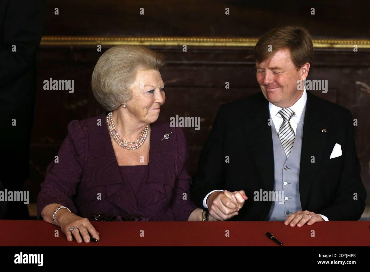 Princess Beatrix and her son King Willem-Alexander hold hands after ...