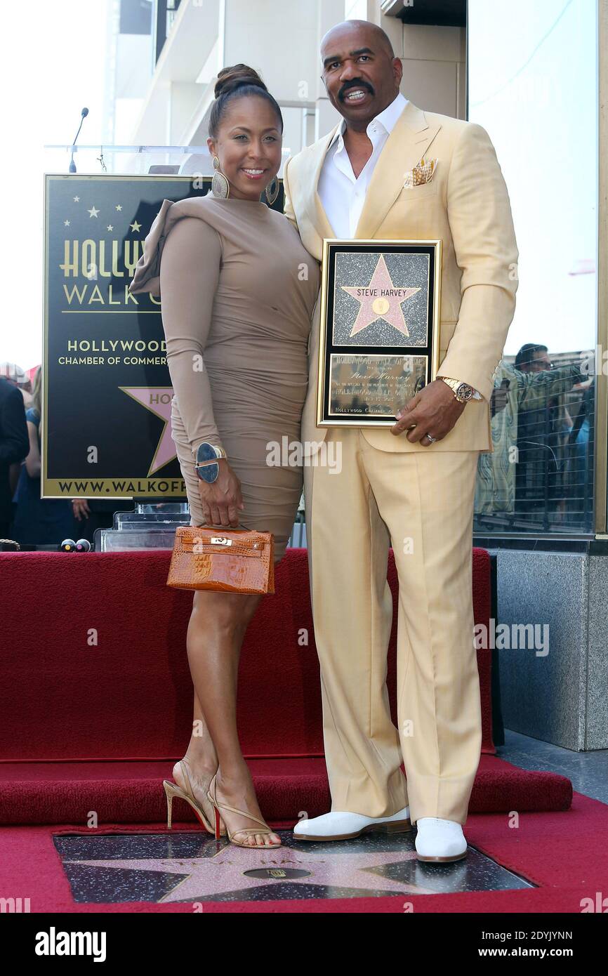 Steve Harvey and wife Marjorie Bridges pose as Harvey receives a star ...