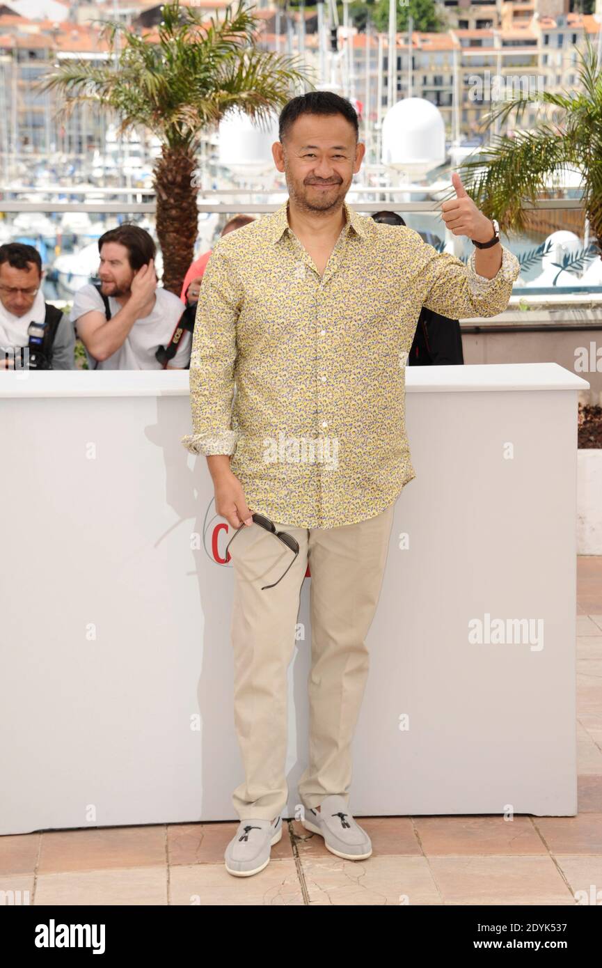 Jiang Wu posing at the 'Tian Zhu Ding' ('A Touch of Sin') photocall ...
