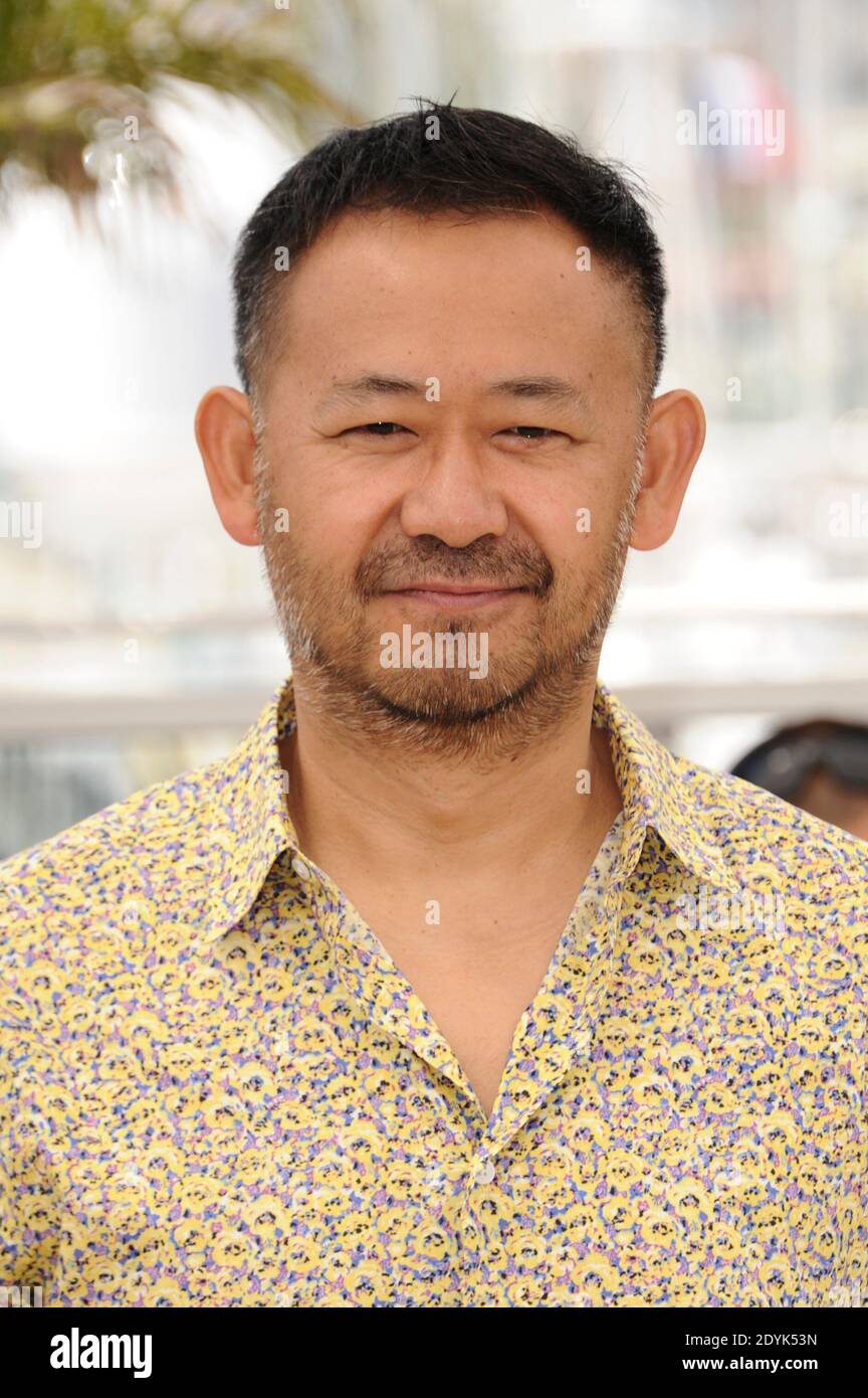 Jiang Wu posing at the 'Tian Zhu Ding' ('A Touch of Sin') photocall ...