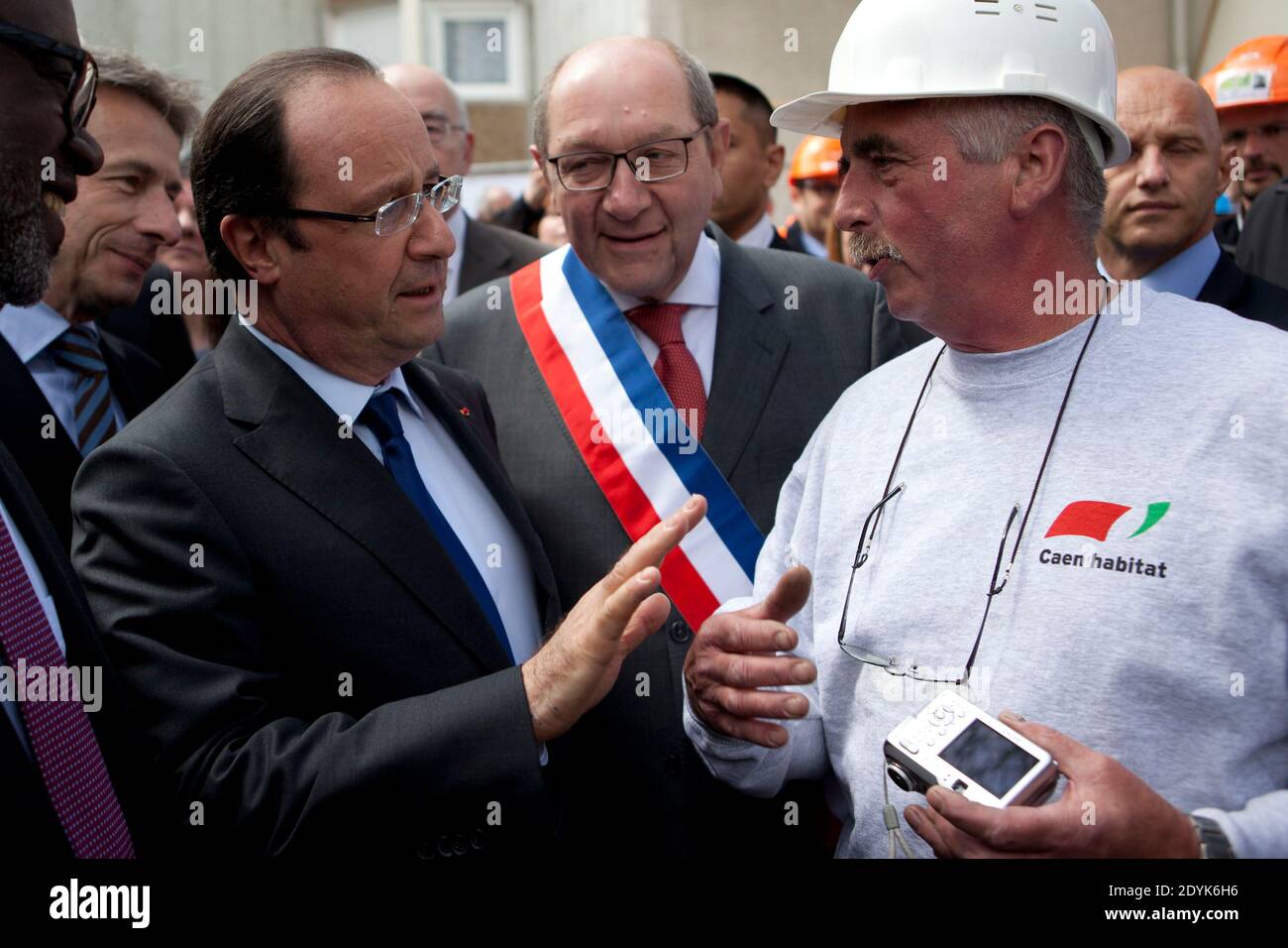 President Francois Hollande meets with locals as he visits the north ...