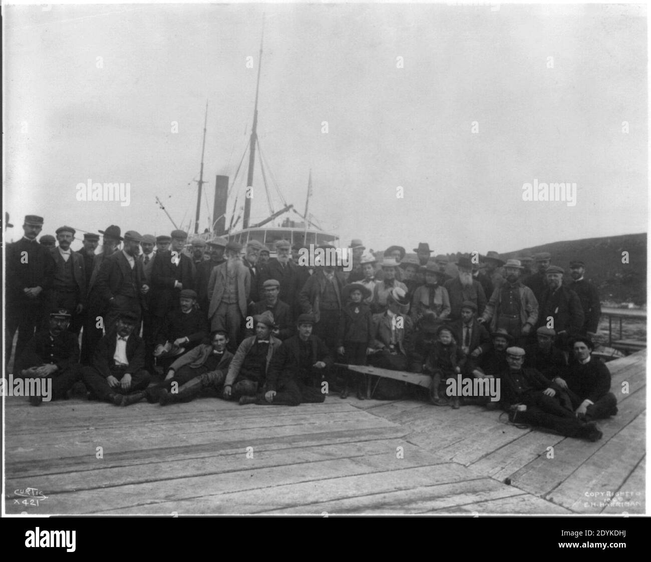Large group of men and women on dock in front of ship, Alaska or the ...