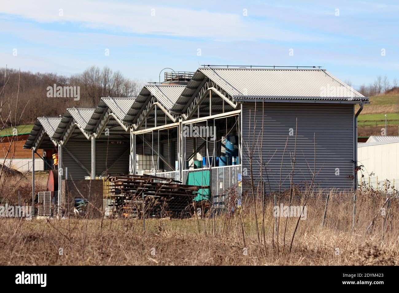 Row of large new metal storage areas with open front side built in ...