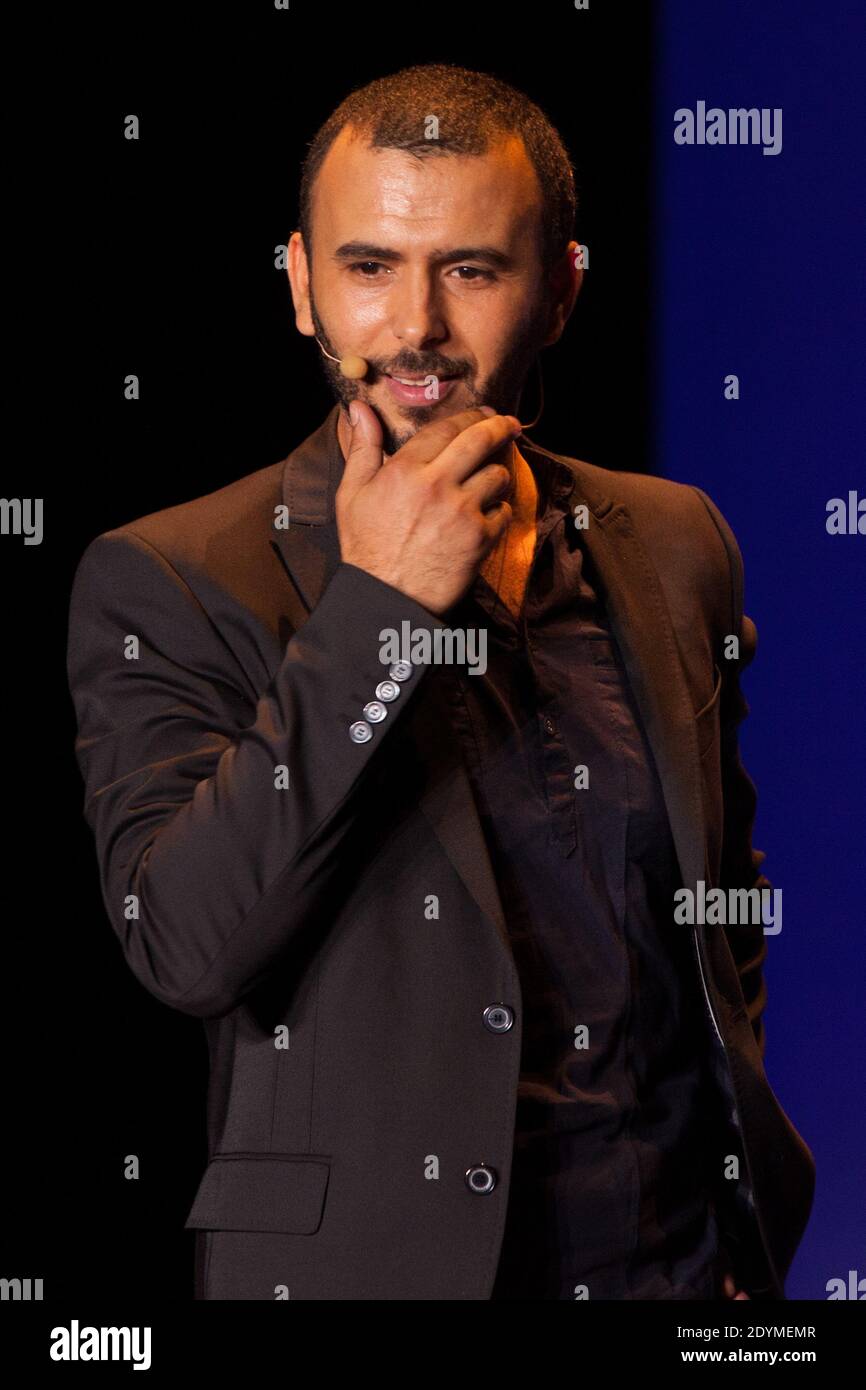 Lotfi Abdelli performs on stage at the Pour La Tunisie Qu’On Aime event ...