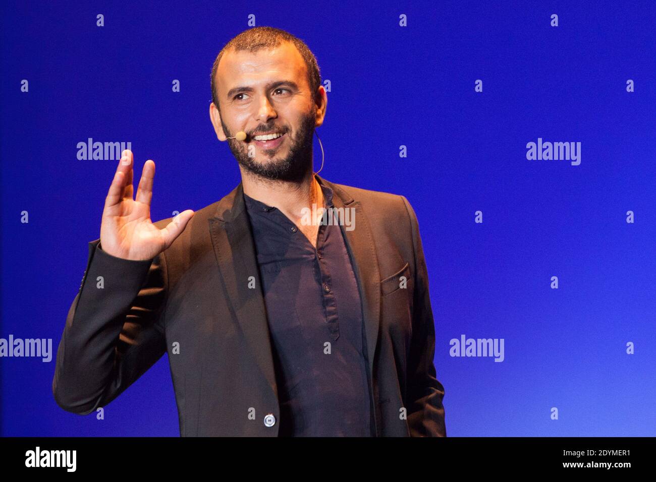 Lotfi Abdelli performs on stage at the Pour La Tunisie Qu’On Aime event ...