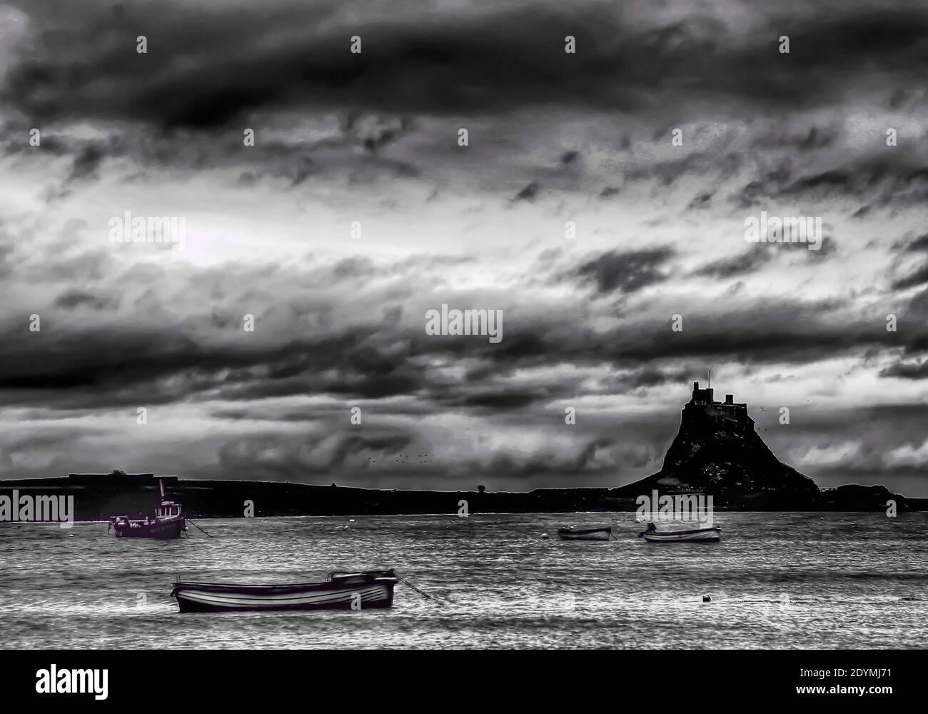 The castle and harbor at Holy Island Stock Photo - Alamy