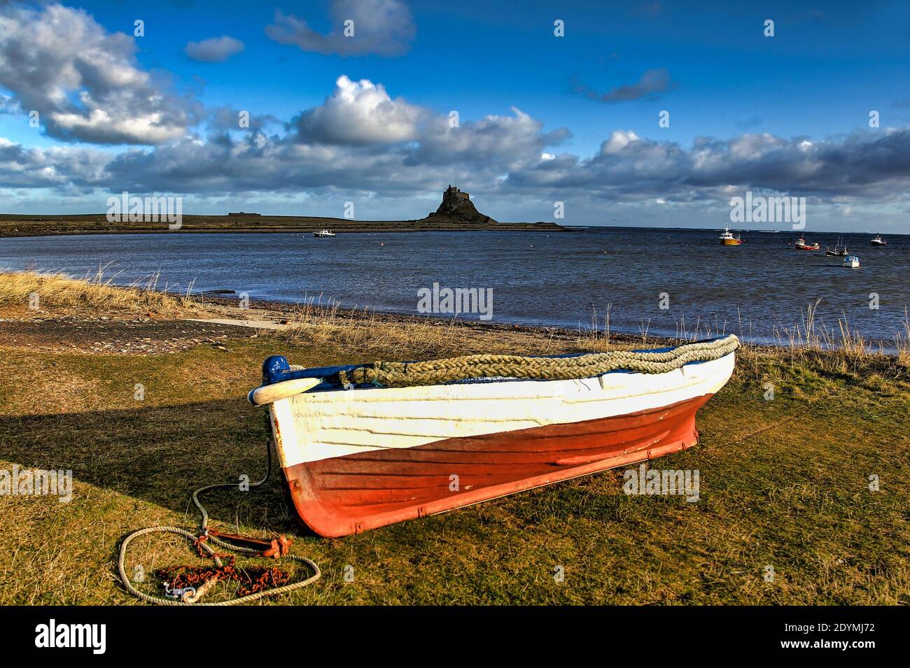 The castle and harbor at Holy Island Stock Photo - Alamy