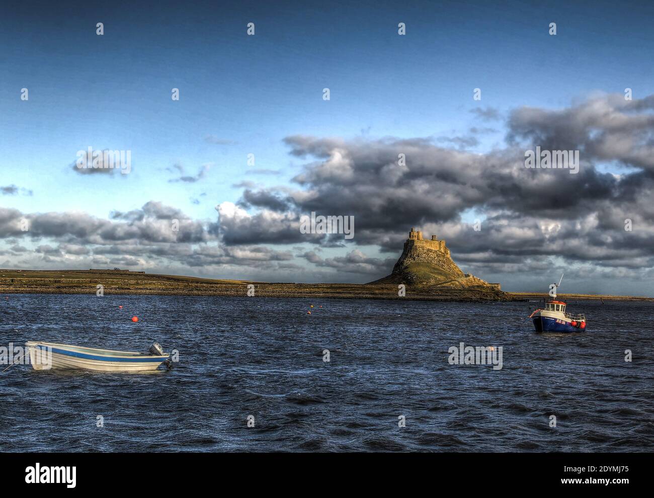 The castle and harbor at Holy Island Stock Photo - Alamy