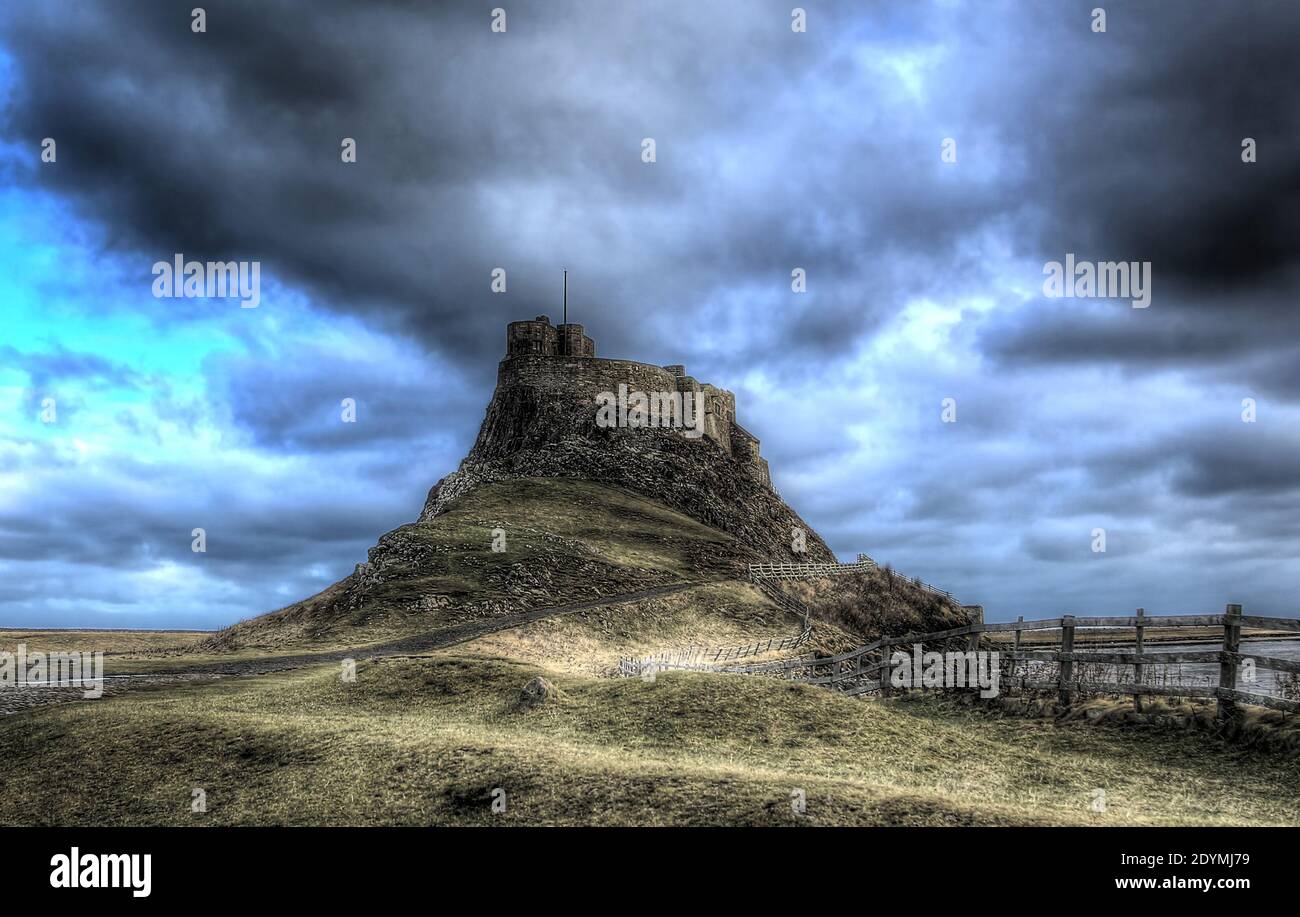 The castle and harbor at Holy Island Stock Photo - Alamy