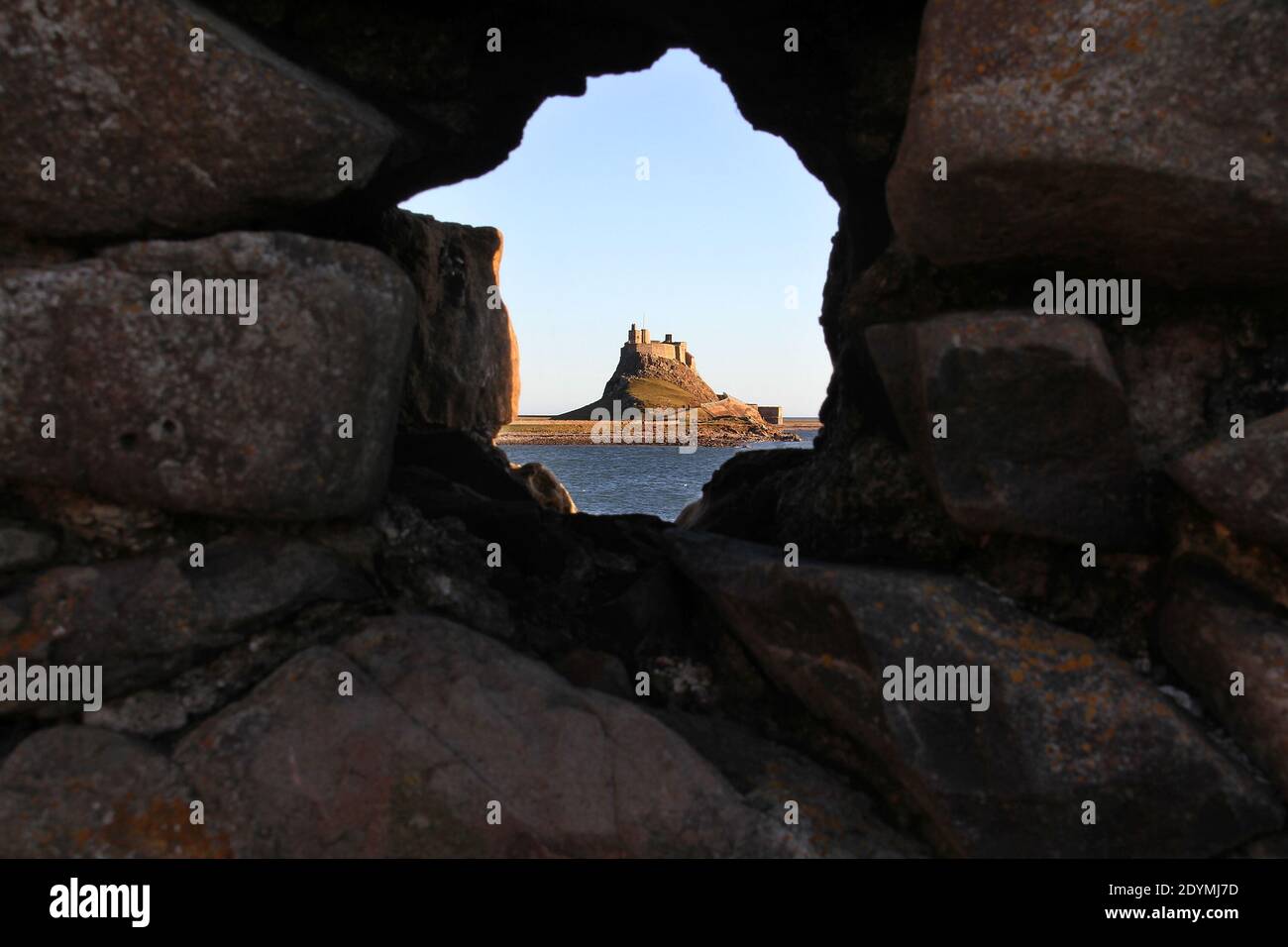The castle and harbor at Holy Island Stock Photo - Alamy