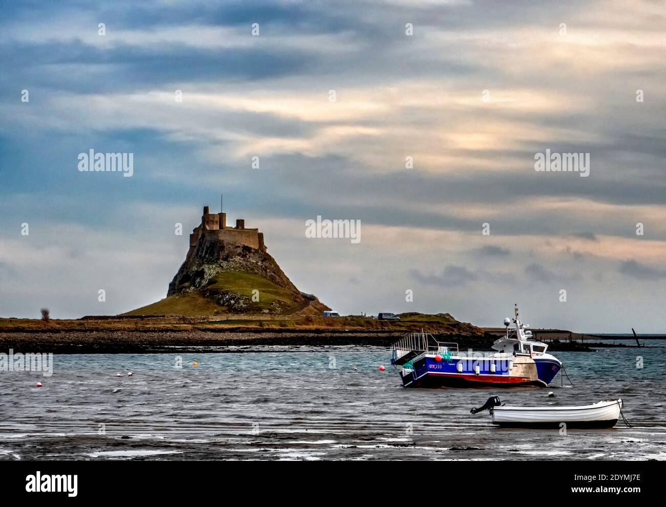 The castle and harbor at Holy Island Stock Photo - Alamy