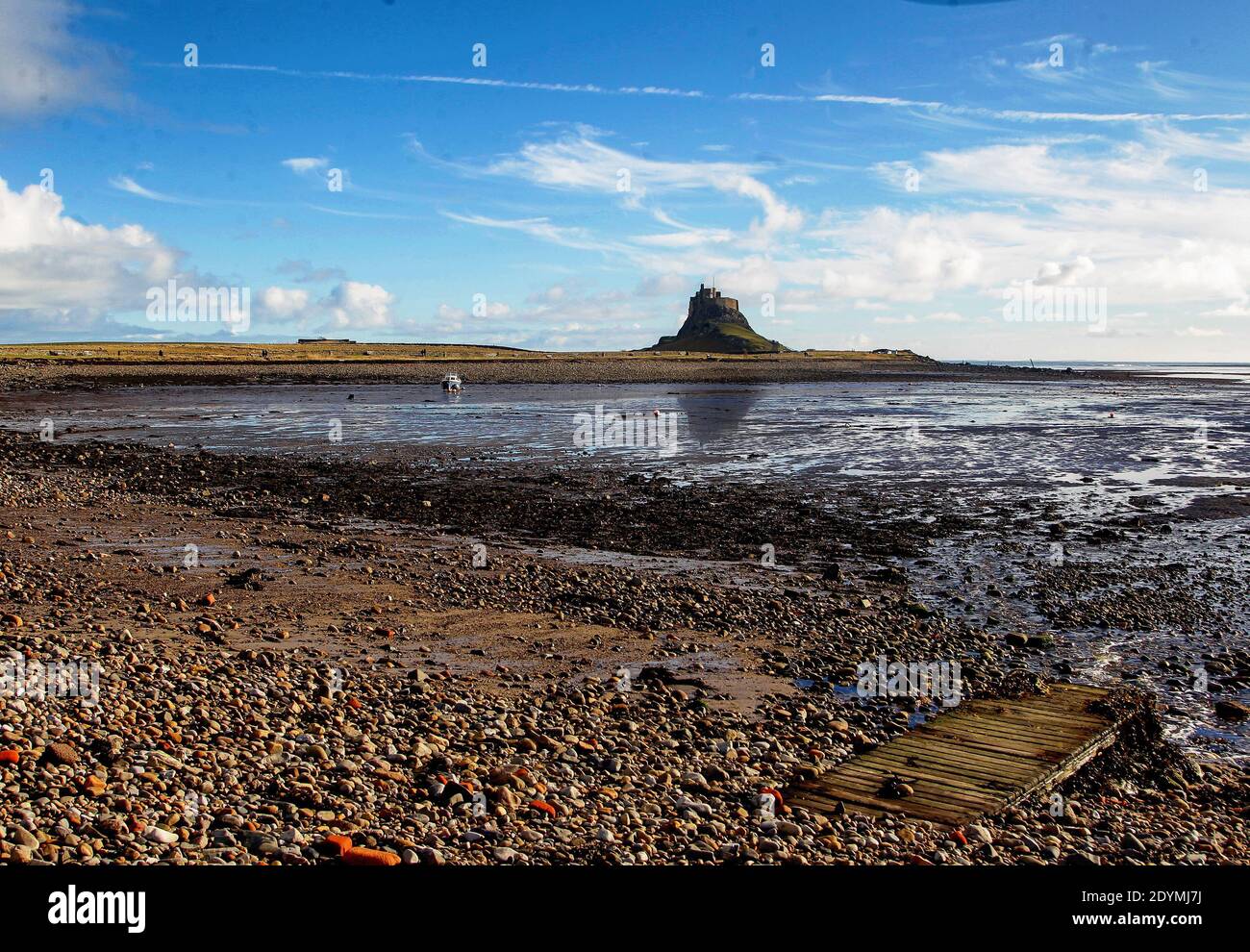 The castle and harbor at Holy Island Stock Photo - Alamy