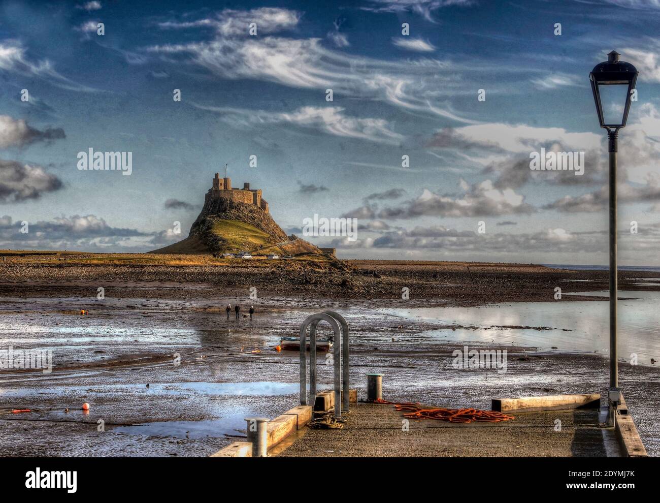 The castle and harbor at Holy Island Stock Photo - Alamy