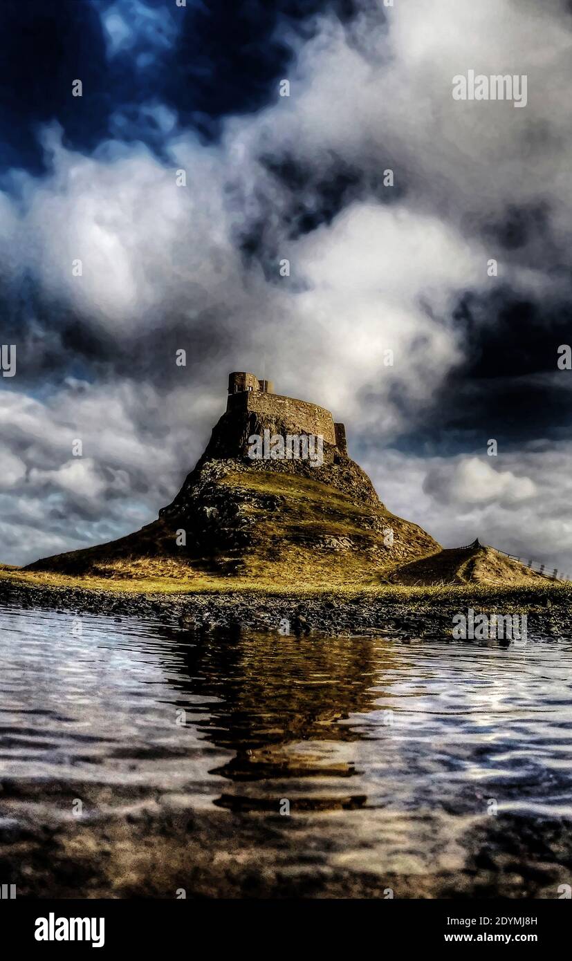 The castle and harbor at Holy Island Stock Photo - Alamy