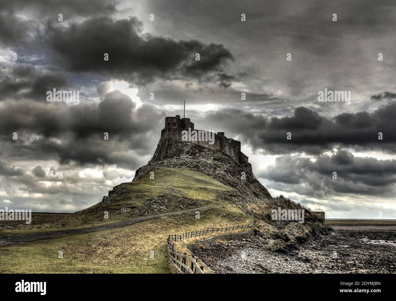 The castle and harbor at Holy Island Stock Photo - Alamy