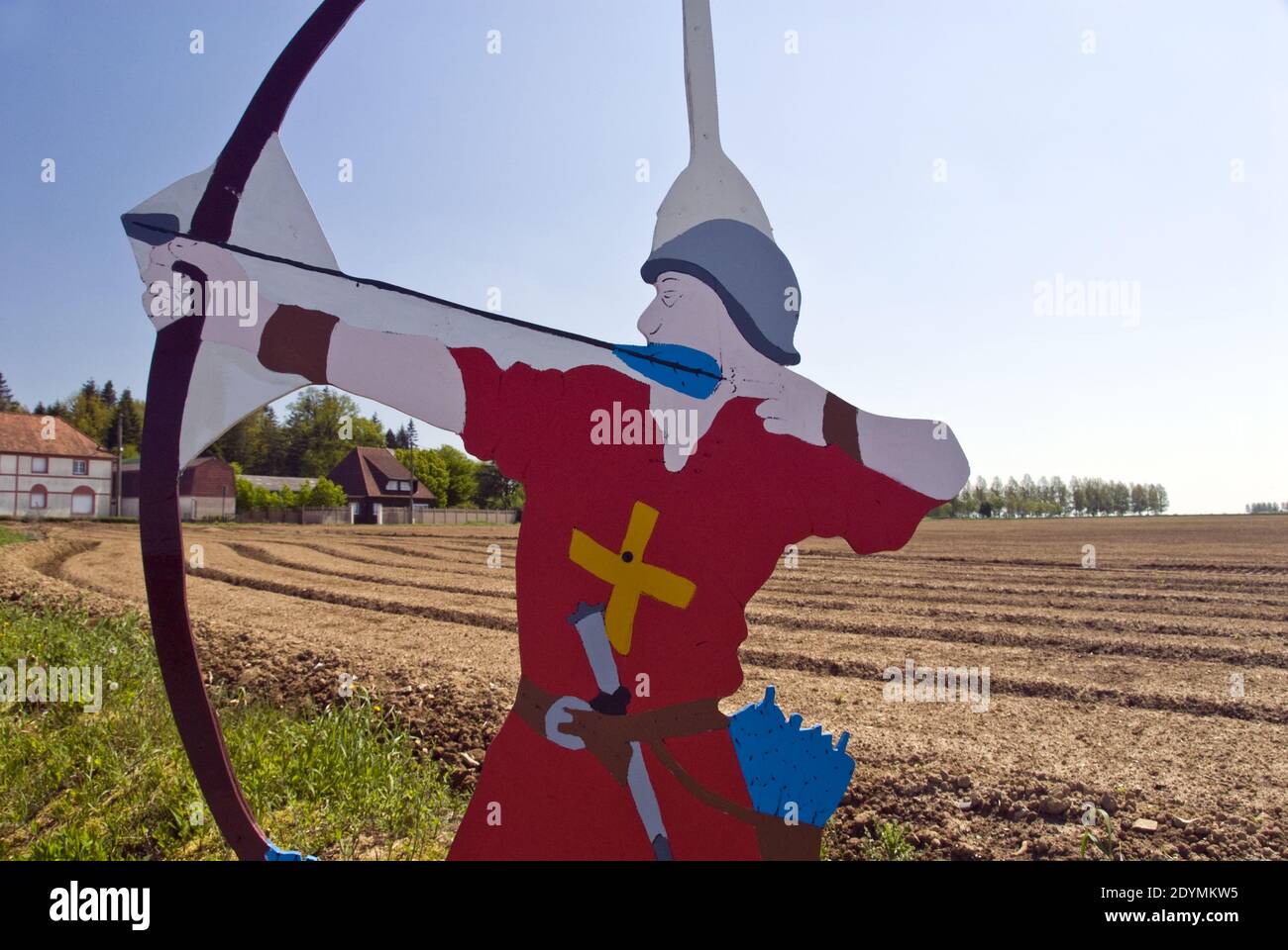 Colorfully painted wood archers stand on the battlefield of Agincourt ...