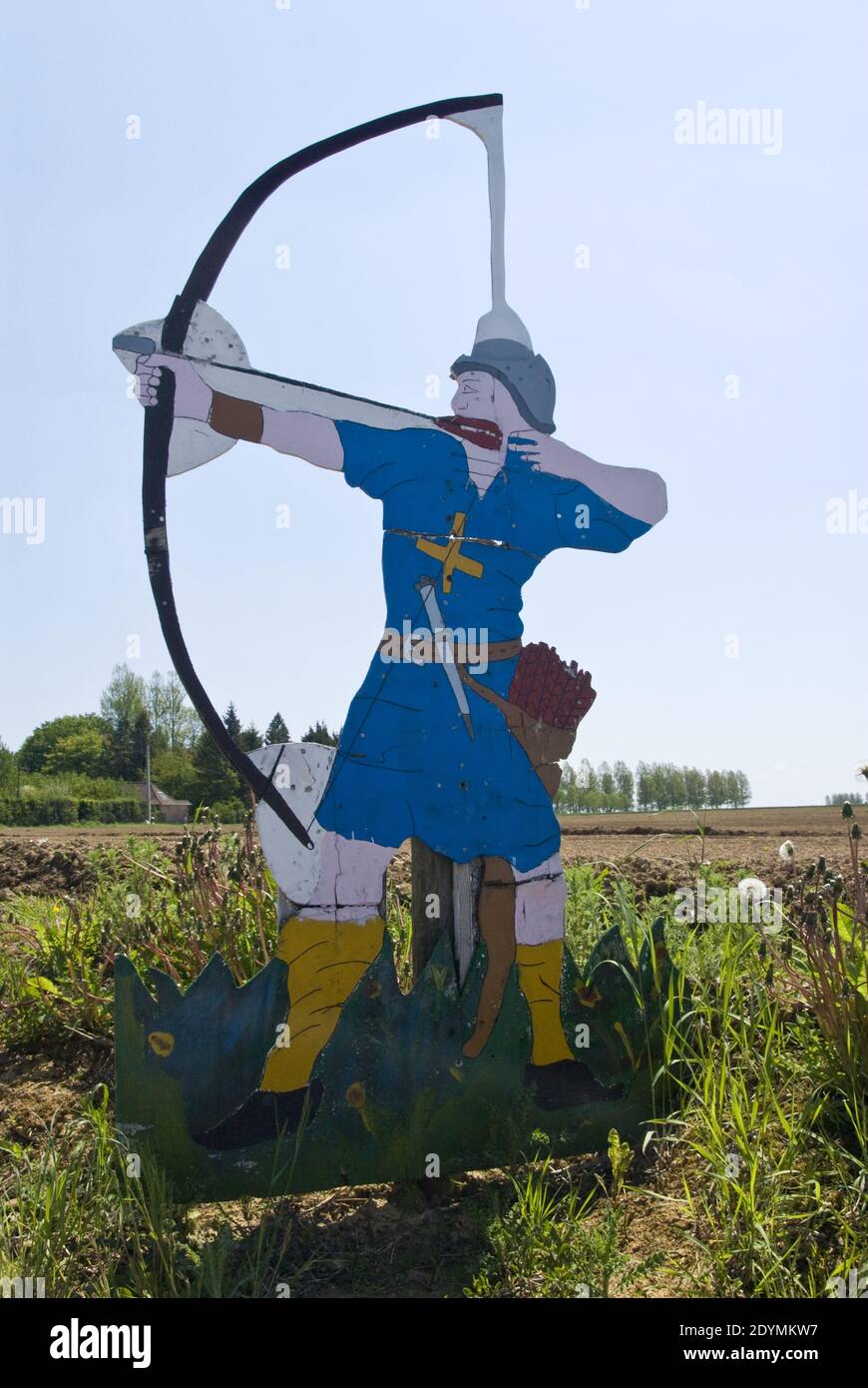 Colorfully painted wood archers stand on the battlefield of Agincourt ...