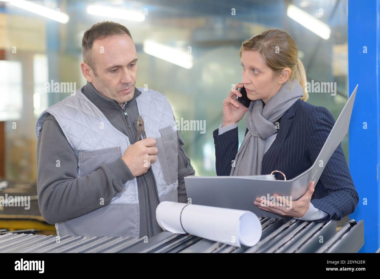 workers in production hall Stock Photo - Alamy