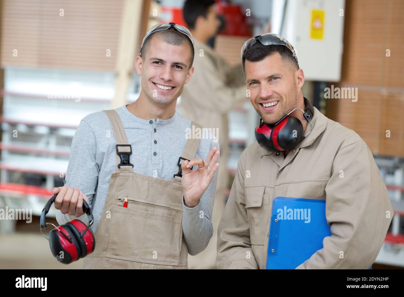 a happy craftsman and apprentice Stock Photo - Alamy