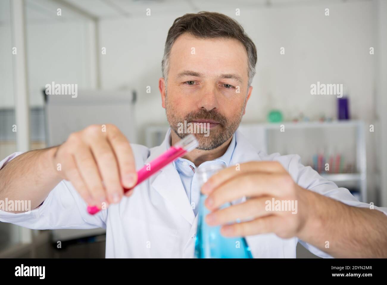 man in the lab fixing liquids Stock Photo - Alamy