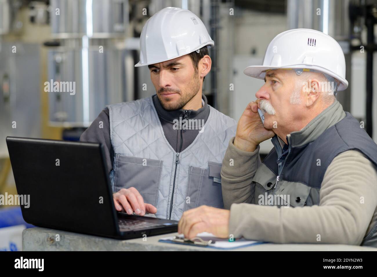 Checking technical data hi-res stock photography and images - Alamy