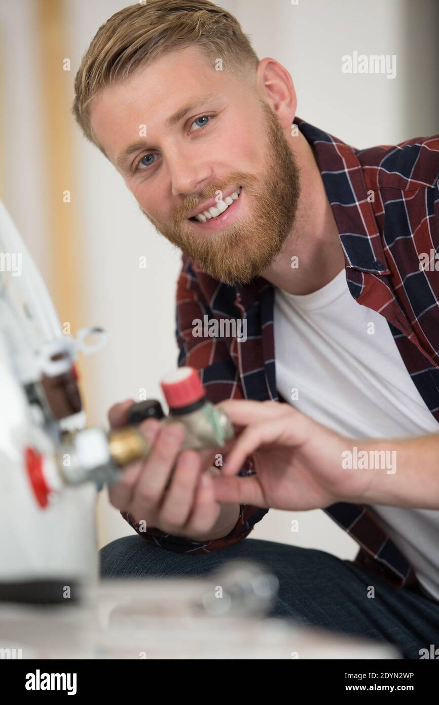 Engineer fixing a boiler hi-res stock photography and images - Alamy