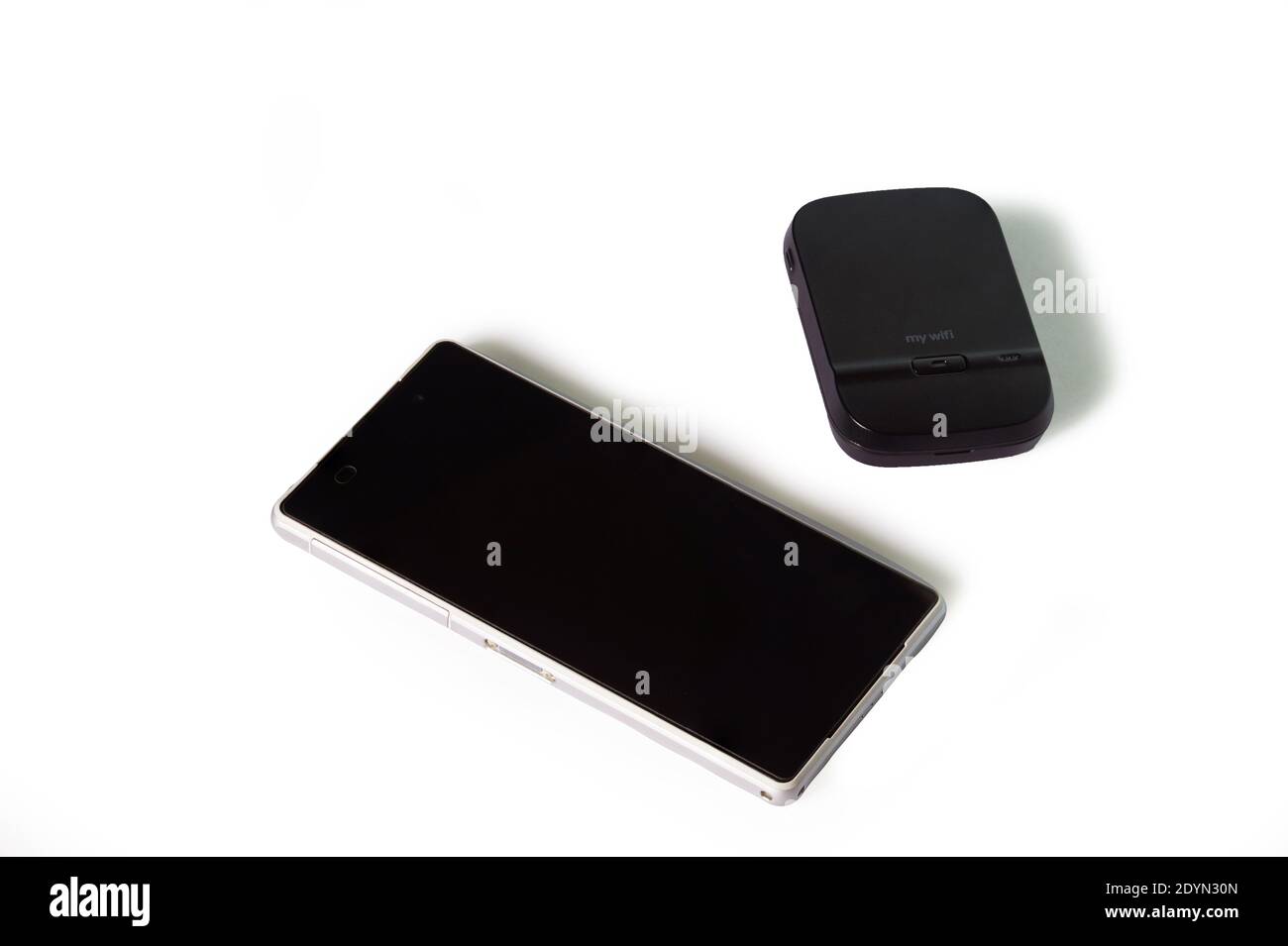 Smartphone and 4g wifi modem in a white background Stock Photo - Alamy