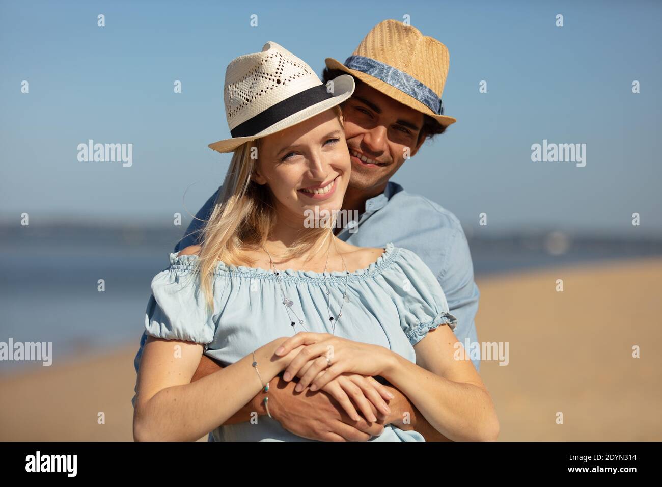 attractive couple cuddling at the beach Stock Photo - Alamy