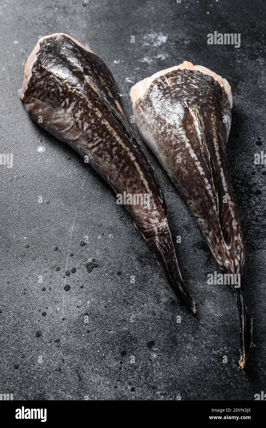 Fresh monkfish without a head. Black background. Top view Stock Photo ...