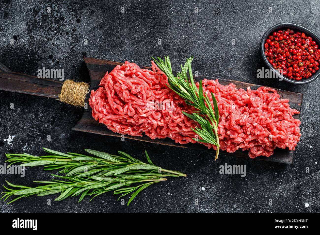 Fresh Raw mince beef, ground meat with herbs and spices. Black ...