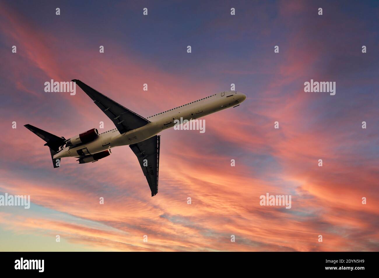 Airplane flying in the sky Stock Photo - Alamy