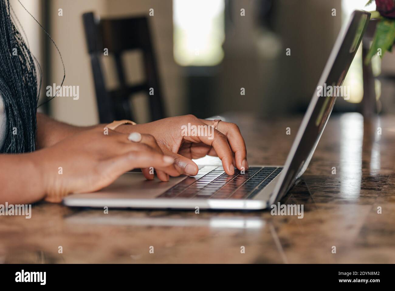 a pair of hands typing away Stock Photo - Alamy