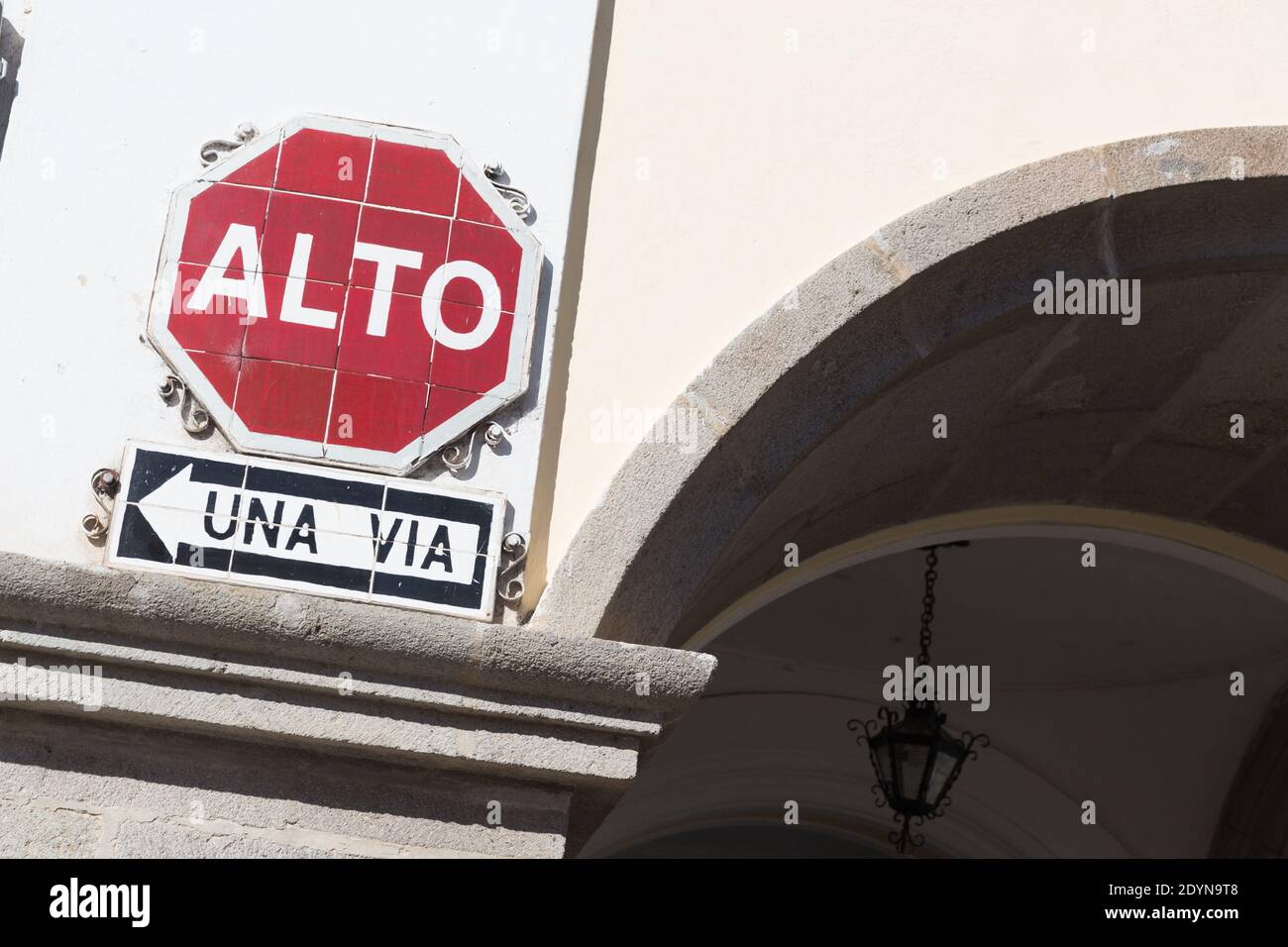 Antigua, Guatemala Stop sign and one way sign made of tile Stock Photo ...