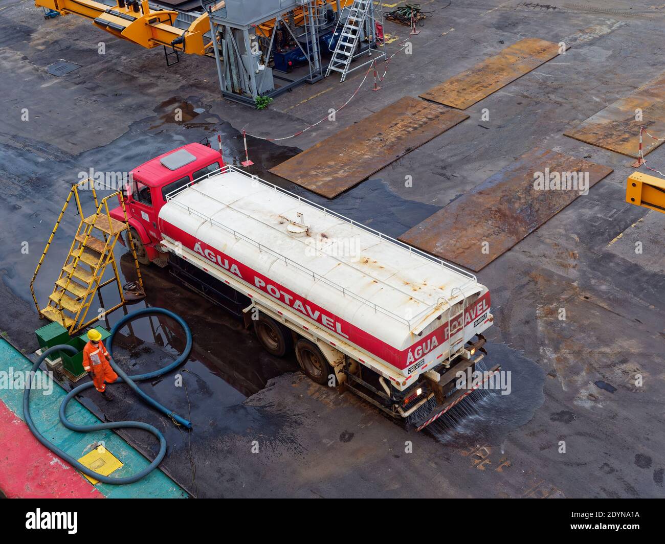A potable water tanker spraying water on to the quay at Rio Old Port ...