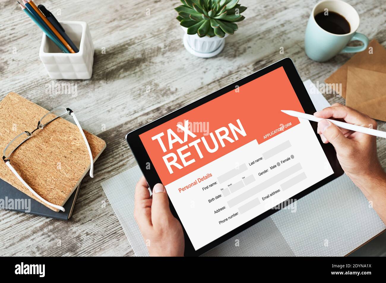 Online tax return application on screen. Business and finance concept ...