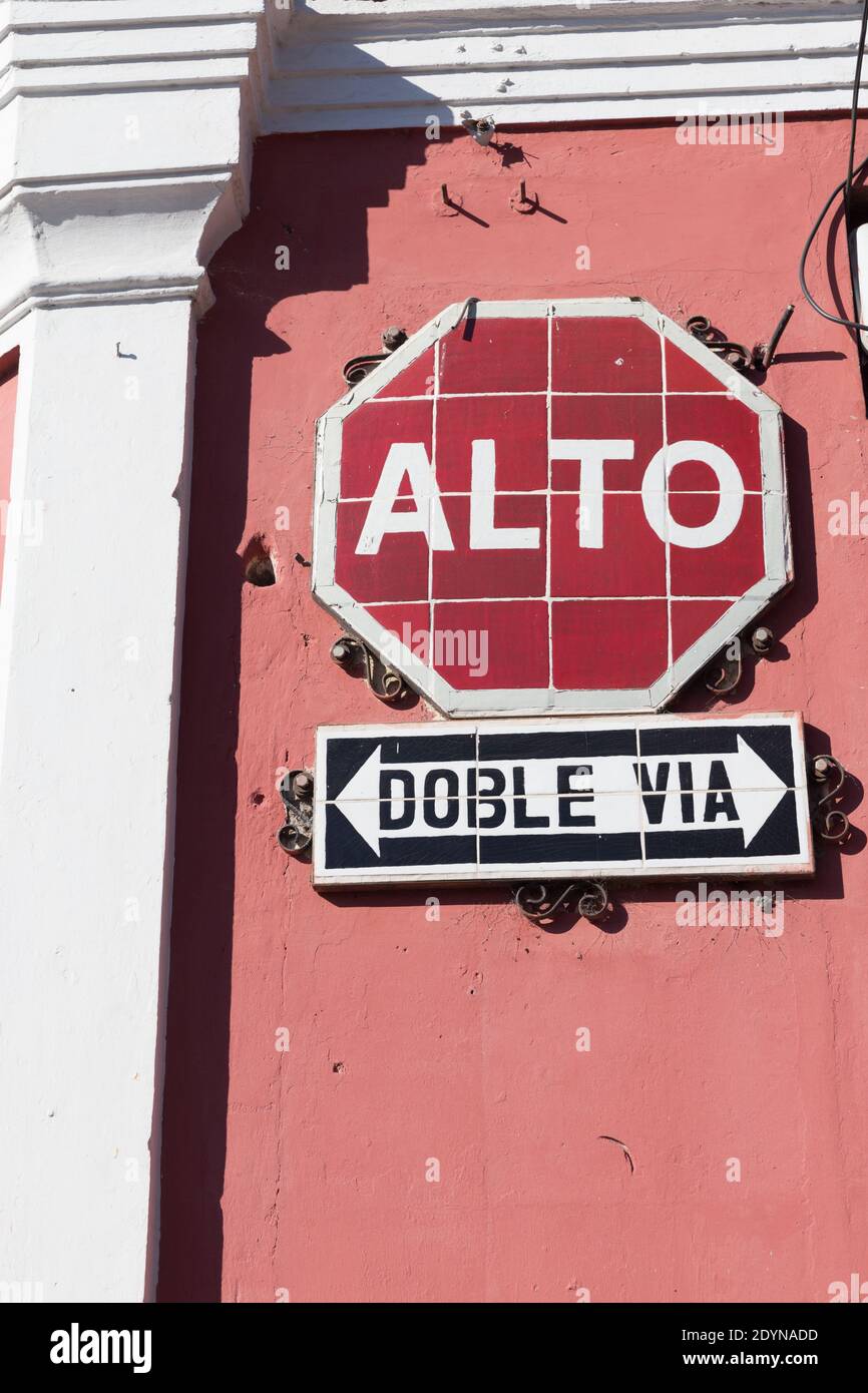 Antigua, Guatemala Stop sign and two way sign made of tile Stock Photo ...