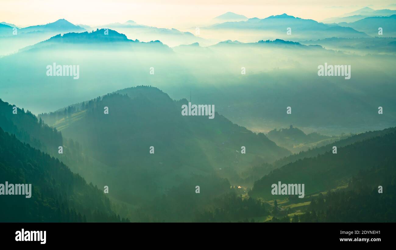 Beautiful green mountains in the morning sunlight; fog scenery in the ...