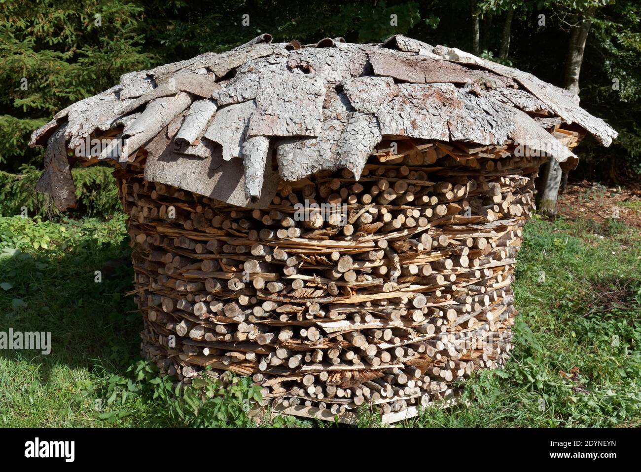 Round stack of firewood, accurately piled up, covered with bark, Baden ...