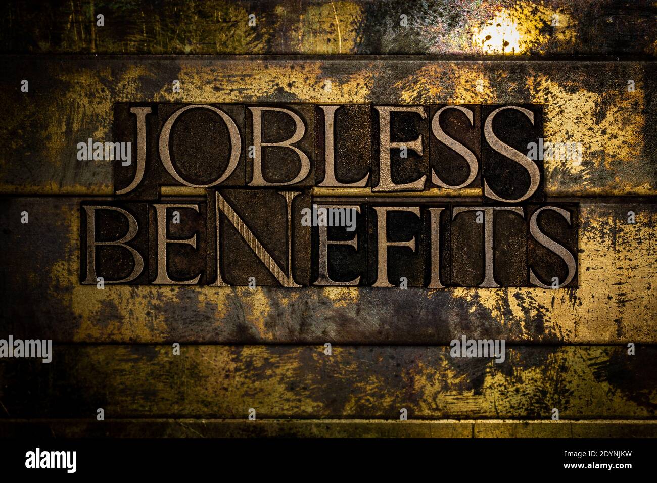 Jobless Benefits text on grunge textured copper and gold background ...