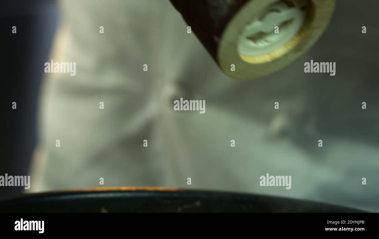 Adding Pepper To Dish Stock Photo - Alamy