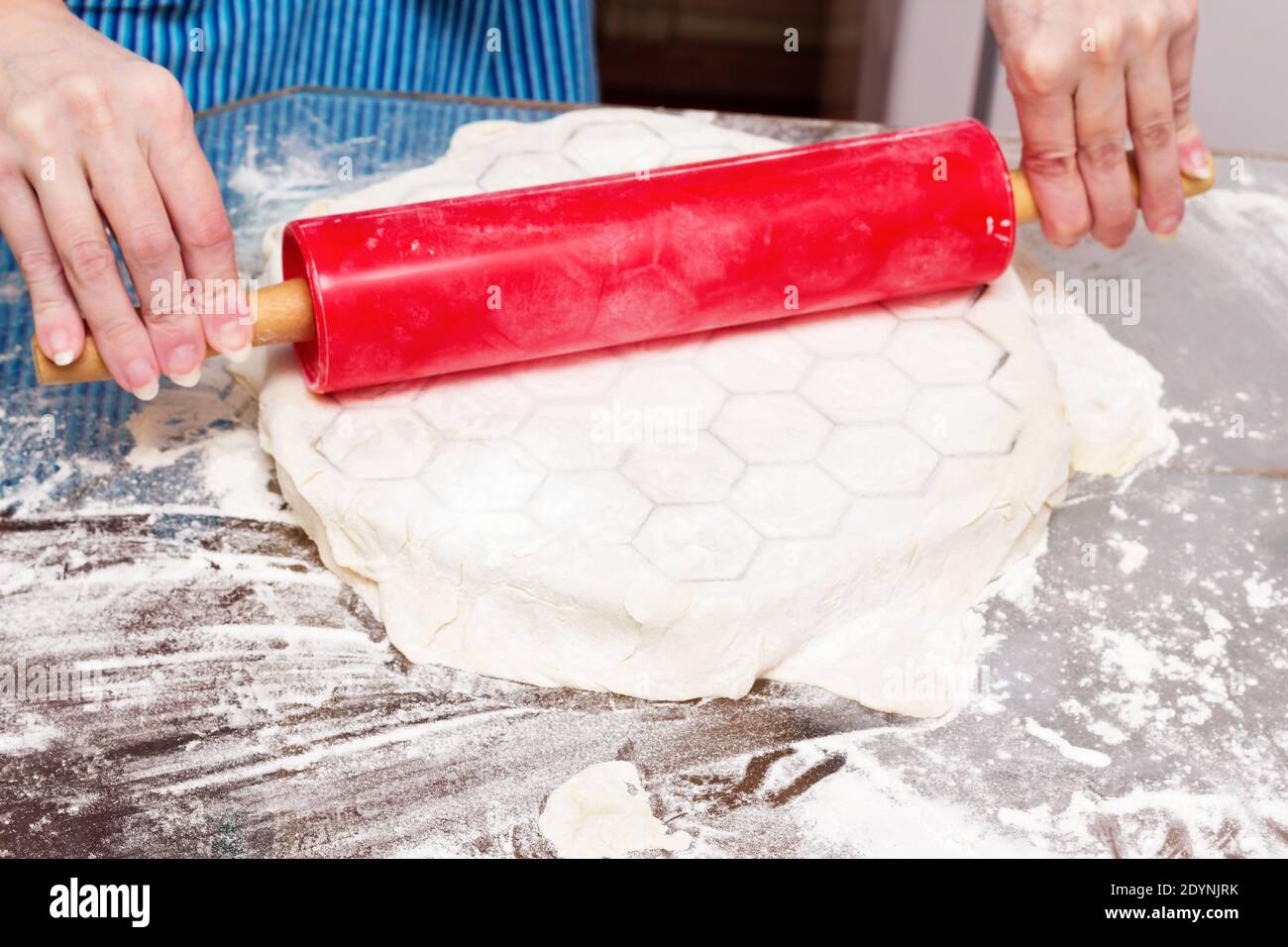 The final stage of molding dumplings at home. A woman is molding ...