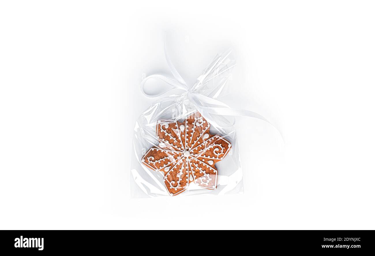Gingerbread in the shape of a snowflake on a white background. High ...