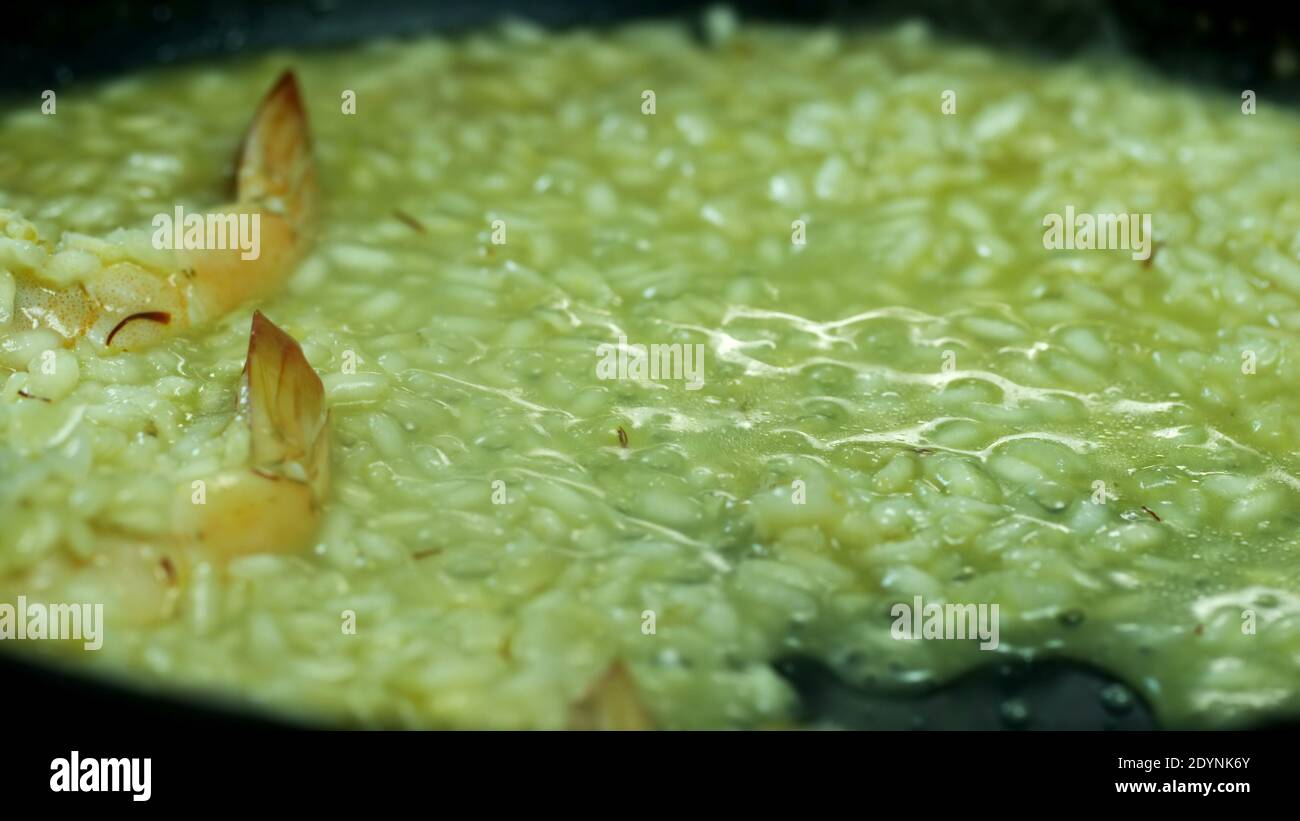 Stirring risotto hi-res stock photography and images - Alamy