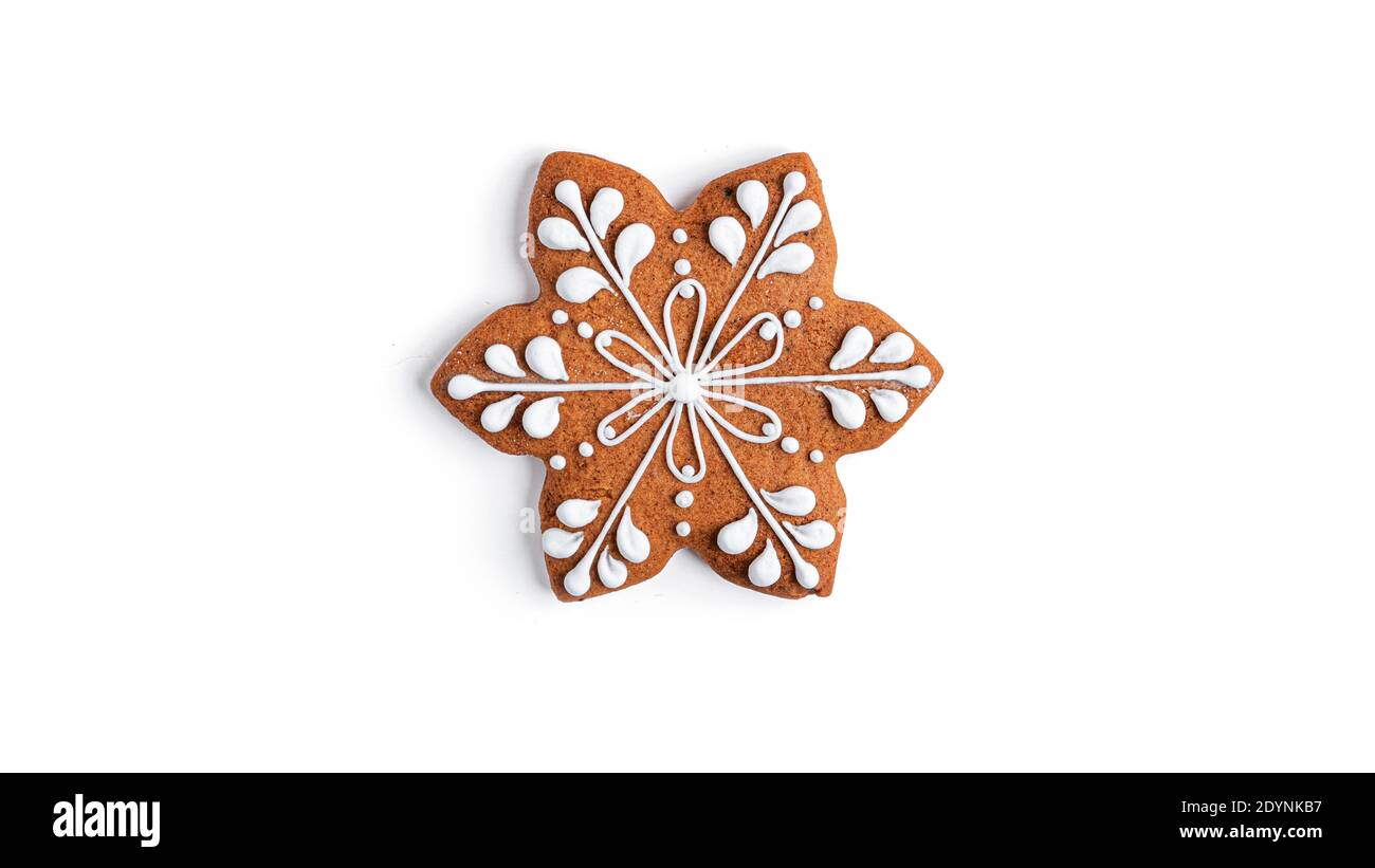 Gingerbread in the shape of a snowflake on a white background. High ...