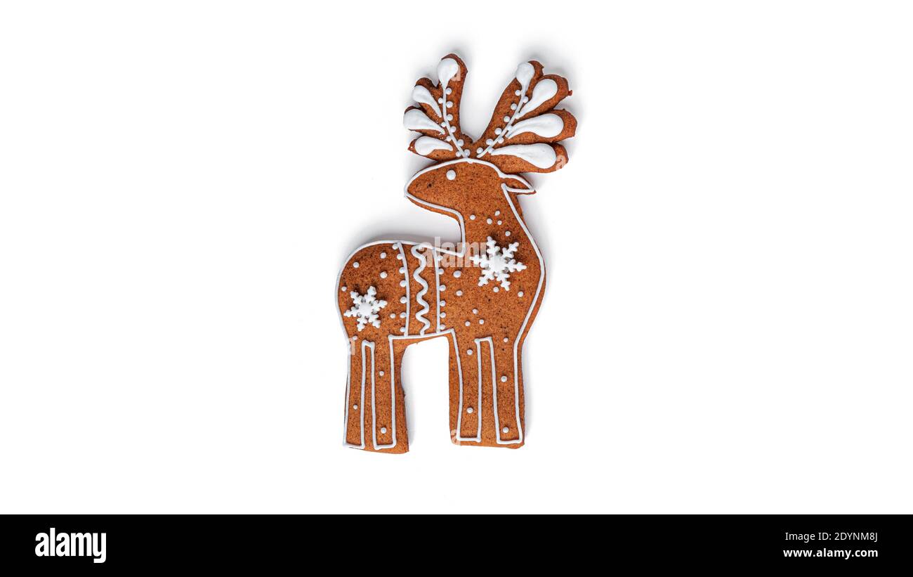 Gingerbread in the shape of a deer on a white background. High quality ...