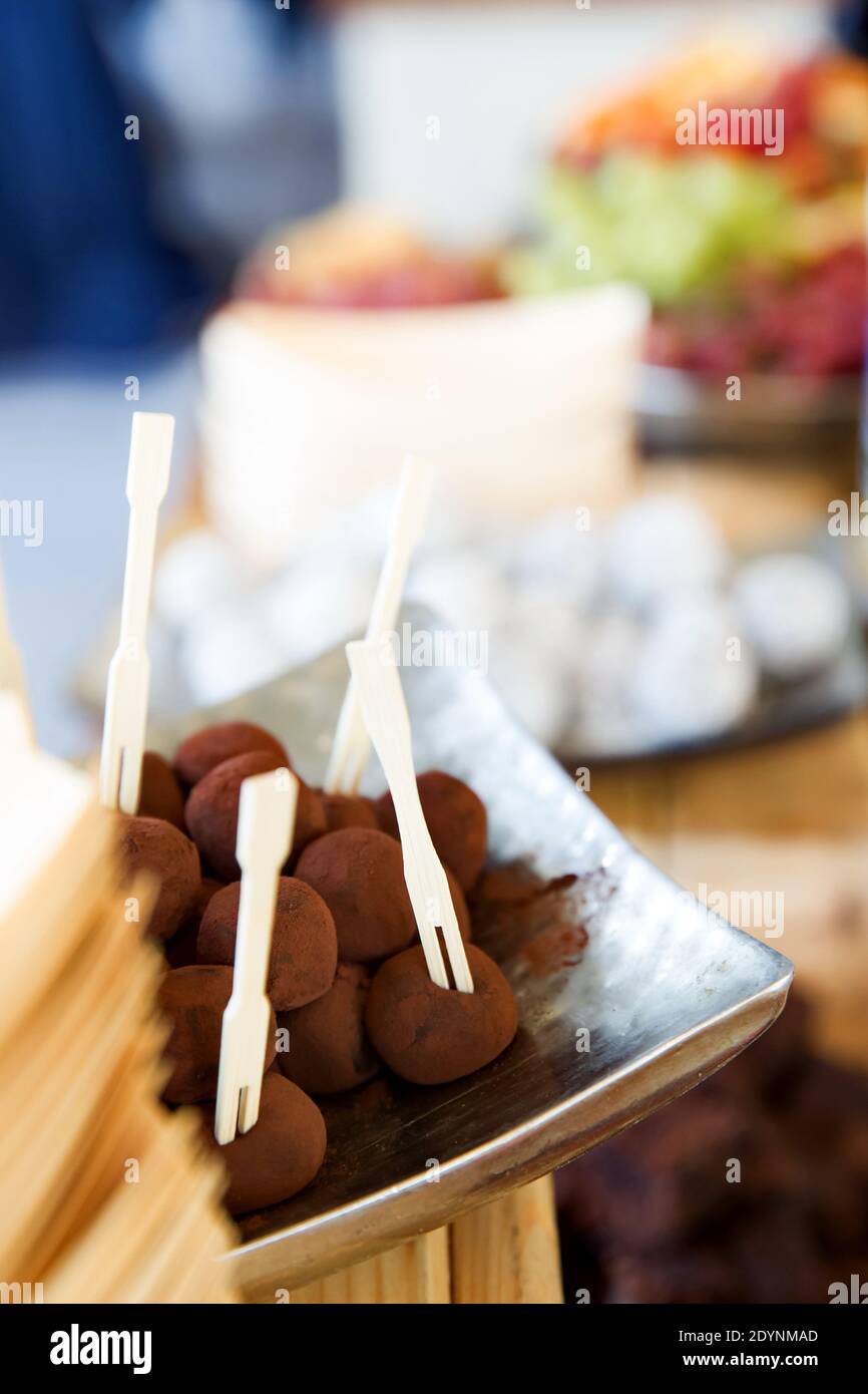 Chocolate truffles with cocoa powder on a buffet table Stock Photo - Alamy
