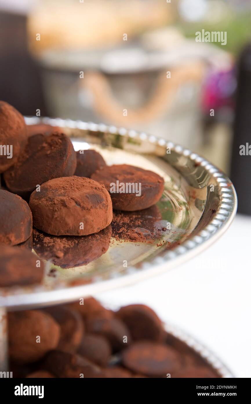 Chocolate truffles with cocoa powder on a buffet table Stock Photo - Alamy