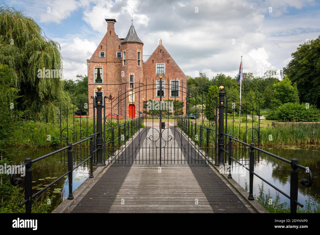Wedde, Netherlands - July 19, 2020; historical medieval house with moat ...