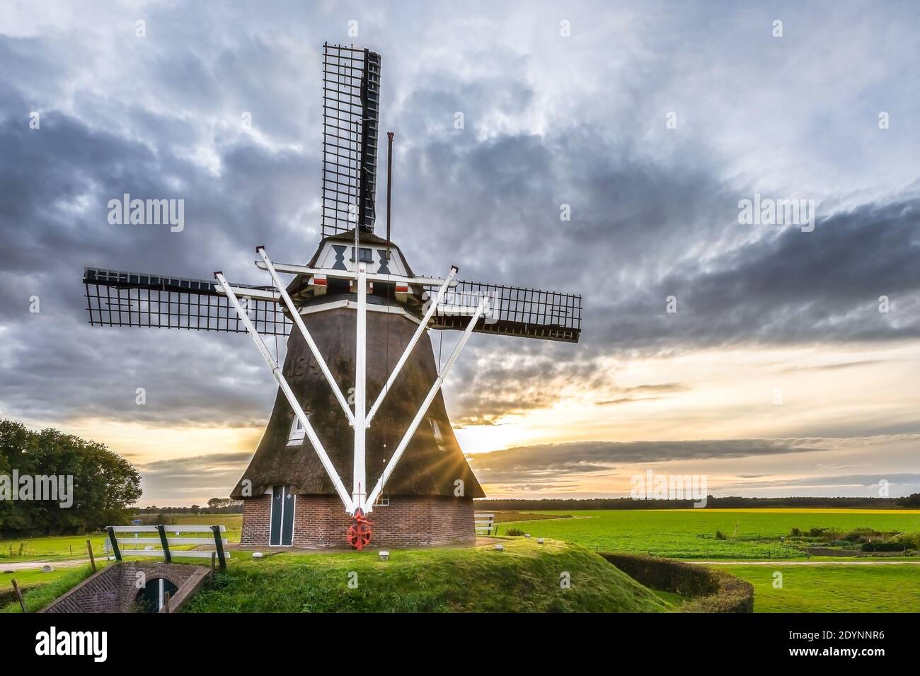 Ancient historic wind mill in Aalden Drenthe Netherlands with clouds ...