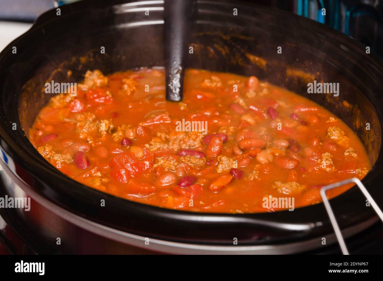 pot of homemade chili ready for serving to the family Stock Photo - Alamy